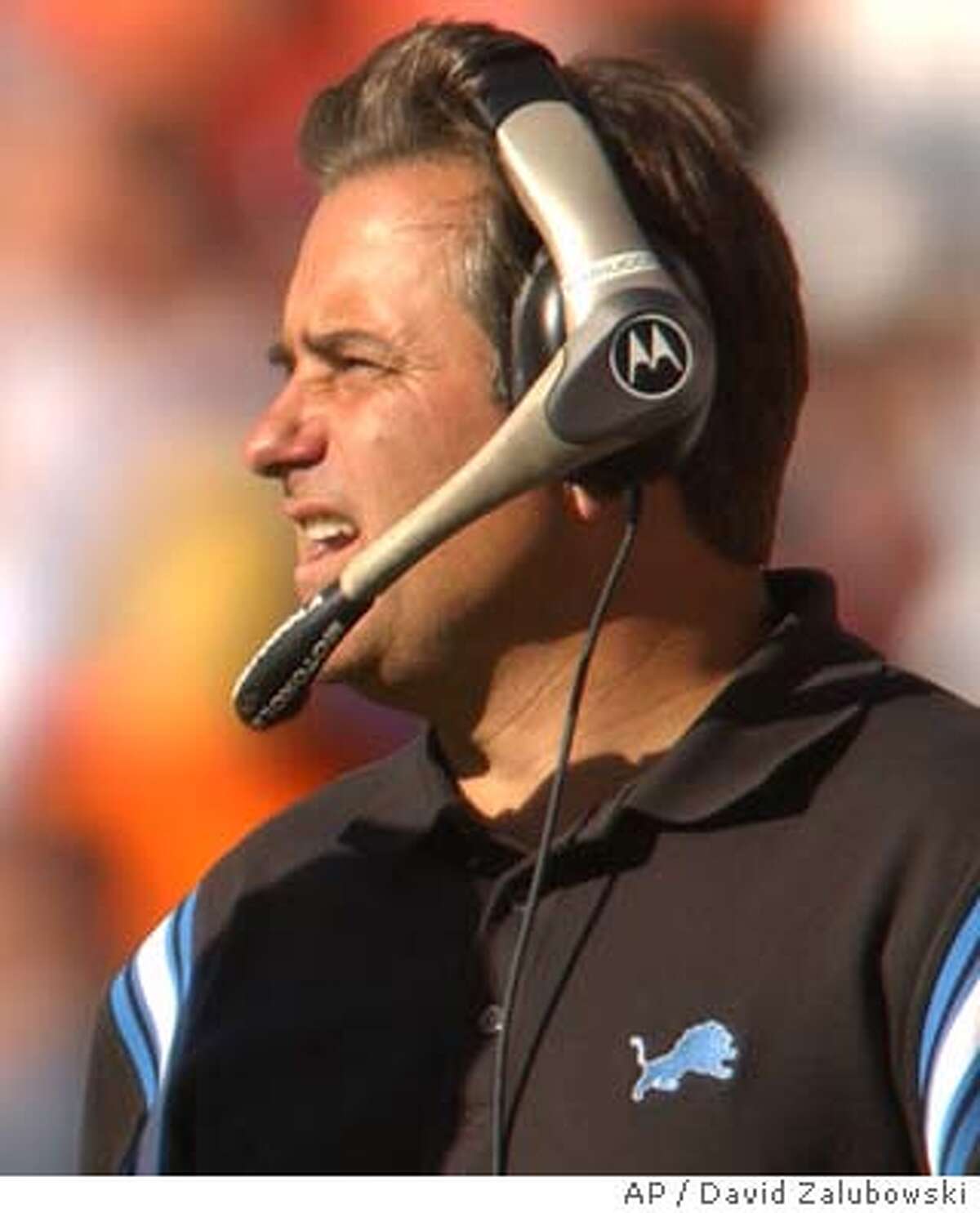 Mariucci stays above the fray / A quiet demeanor as he brings Lions to S.F.