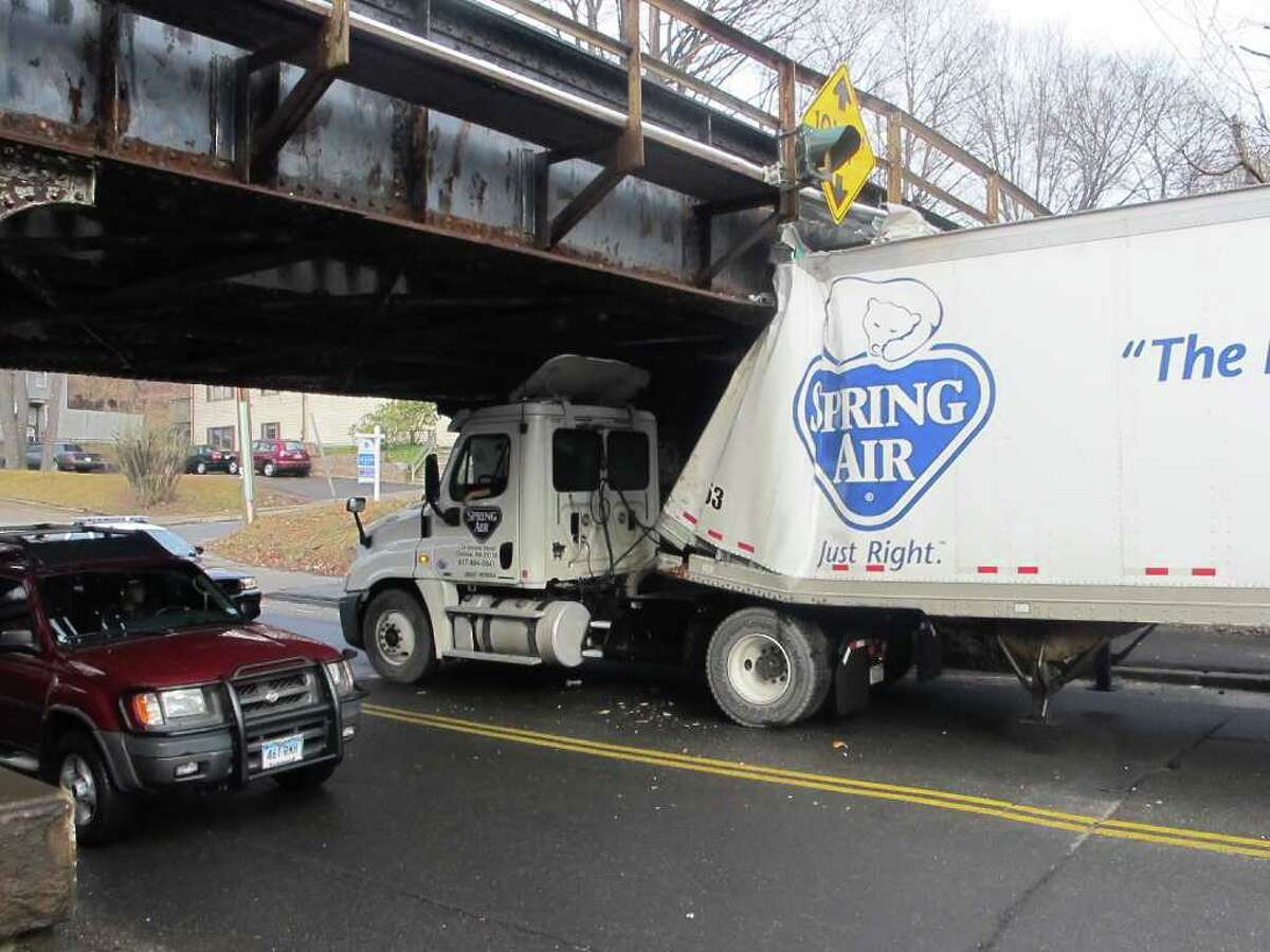 Tractor-trailer crashes into bridge
