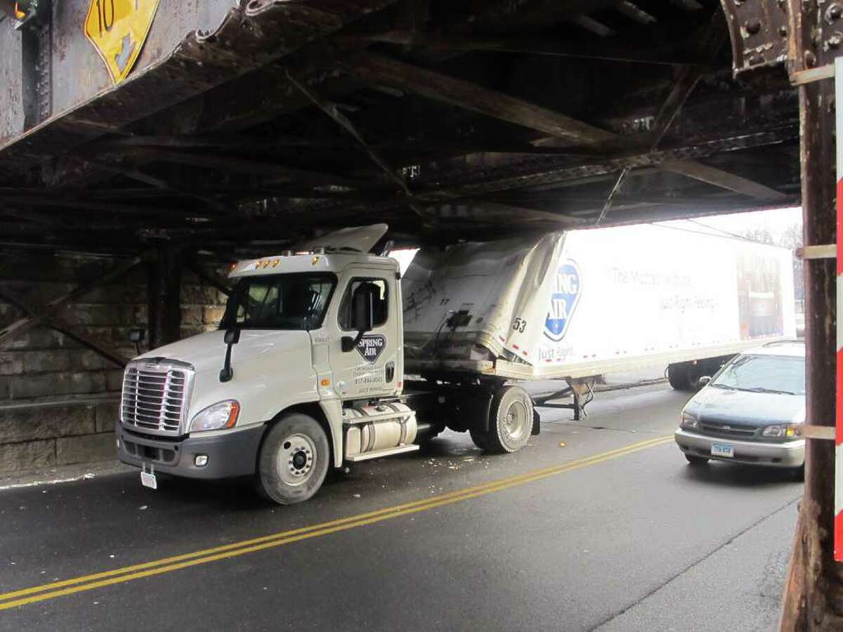 Tractor-trailer crashes into bridge