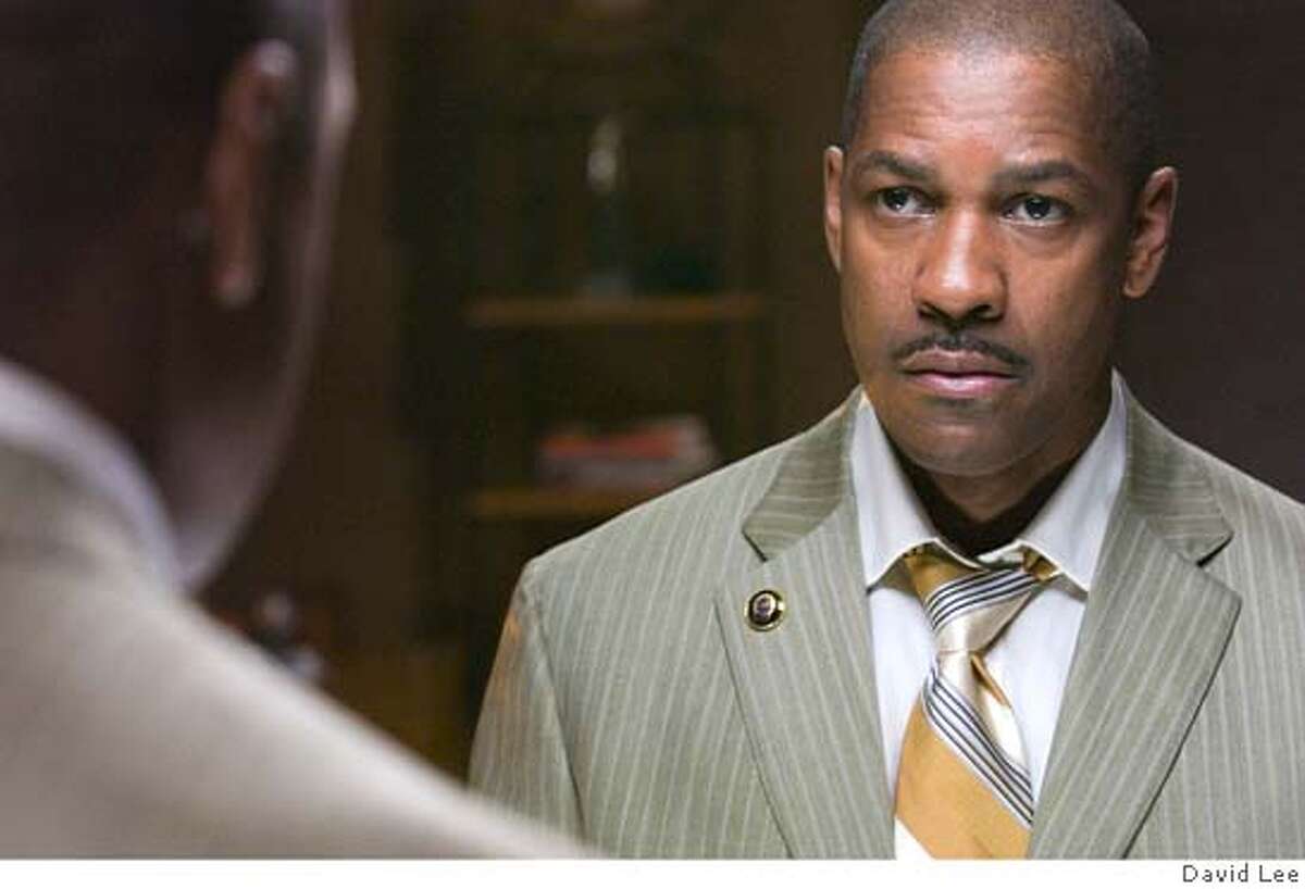 MOVIE REVIEWS / A masked man robs a bank. There's something inside he ...