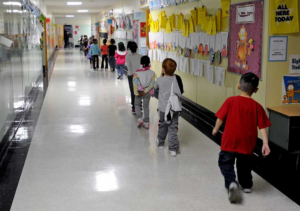 Children Walking In The Hallway