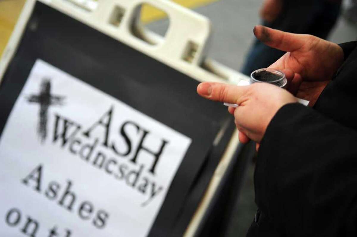 Commuters receive ashes to go in Stamford