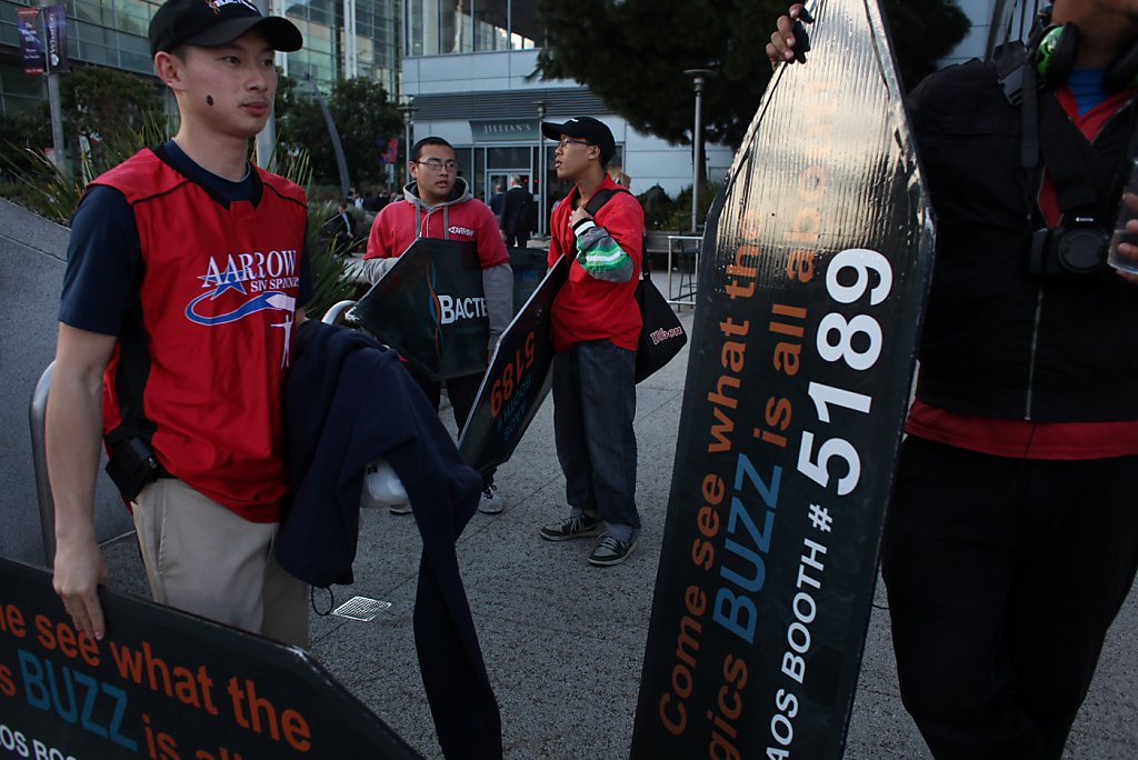 Sign-spinning street dancer points the way