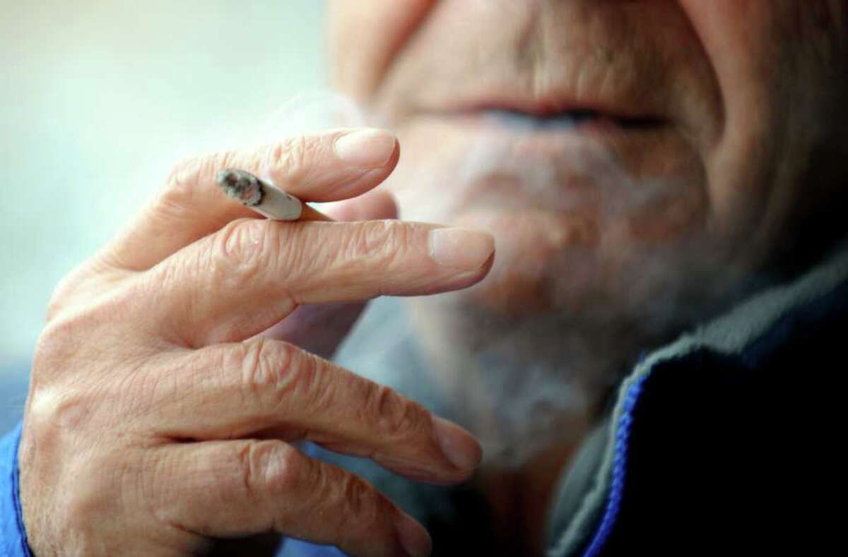 Big tobacco snuffs out new cigarette warnings, for now