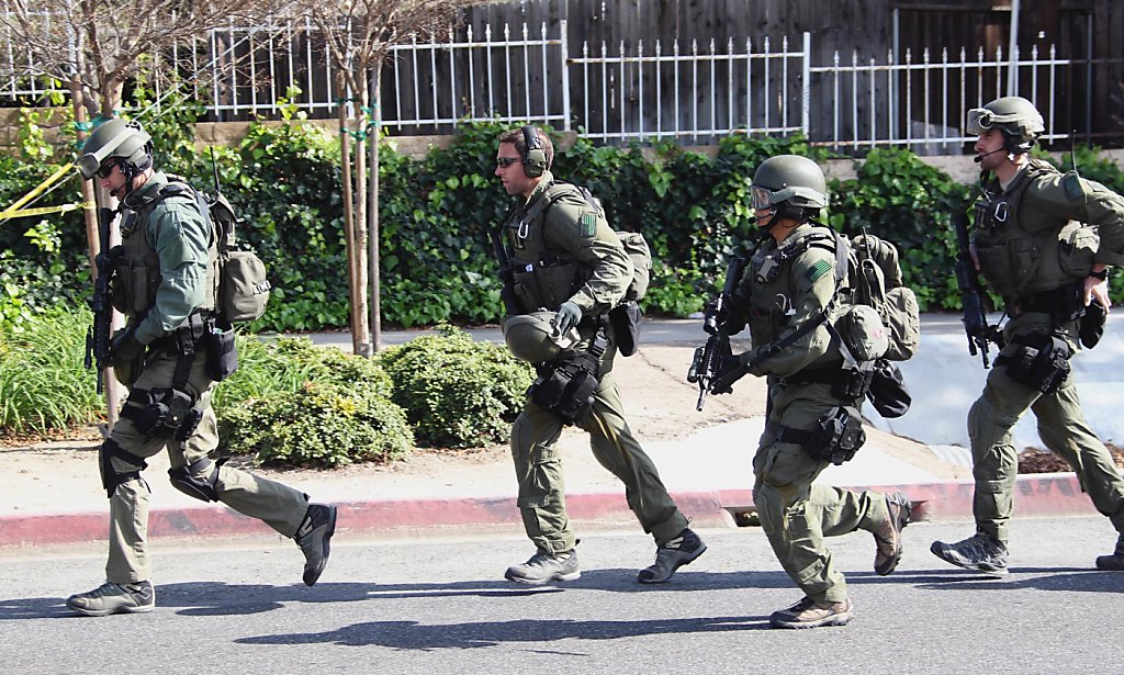 Hostage saved after would-be bank robber wounded