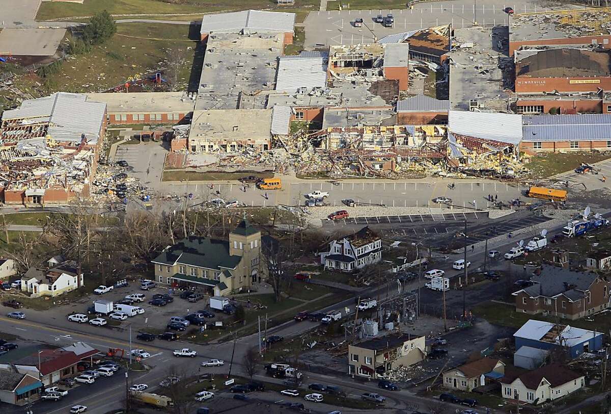 Tornado survivors emerge to find devastation