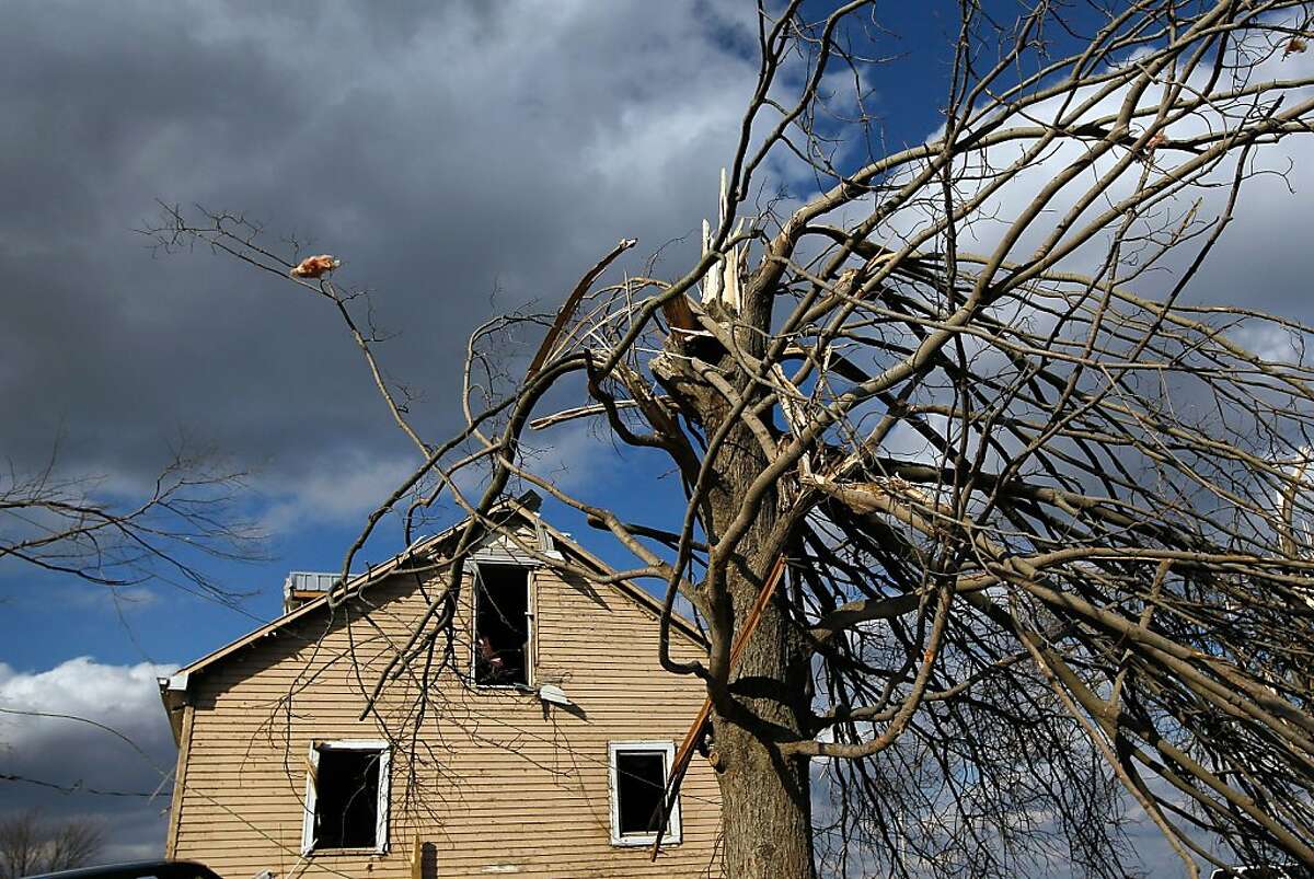 Tornado survivors emerge to find devastation