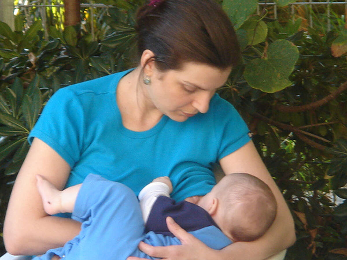 Breastfeeding mom stages Facebook photo campaign