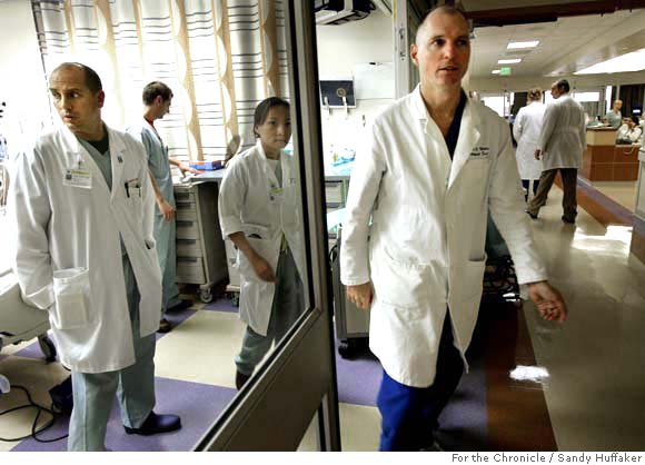 A TOP SURGEON ENLISTS / Duty and honor: Dr. Martin Holland quit his job ...