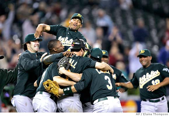 BUBBLY IN SEATTLE / A's win, Angels lose, magic number zero