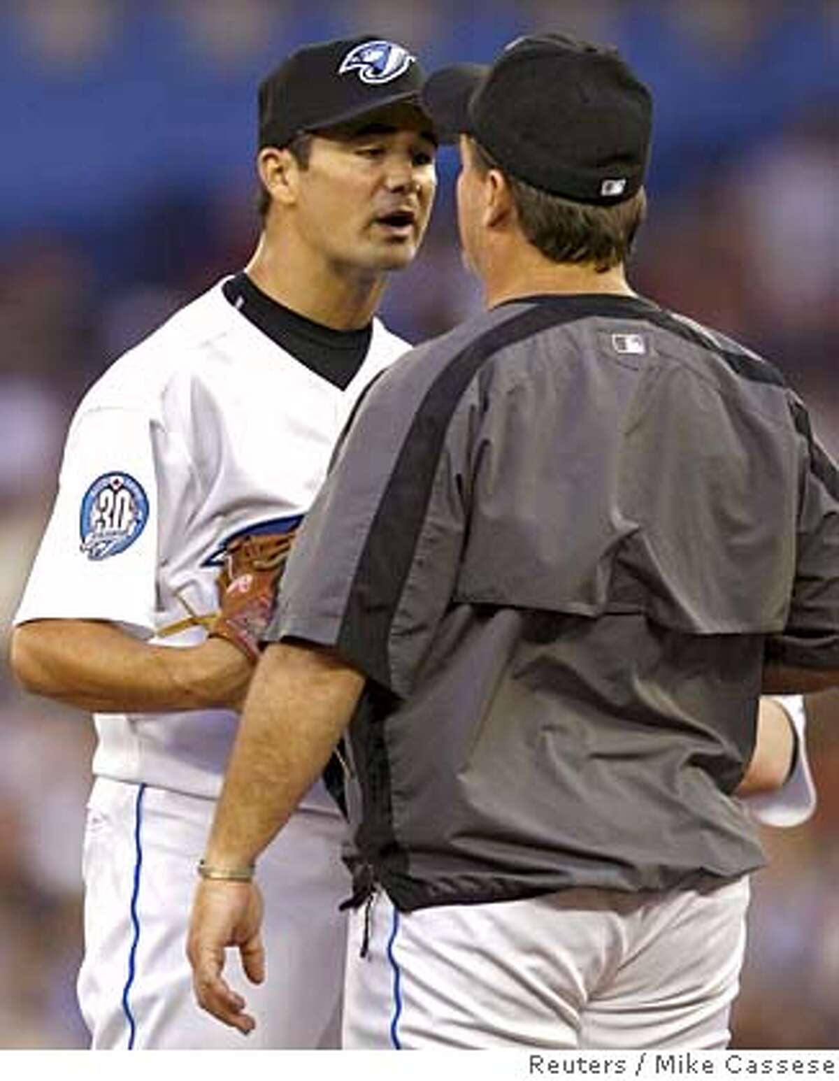 EIGHT ISN'T ENOUGH / A's pull off comeback, upend bickering Jays