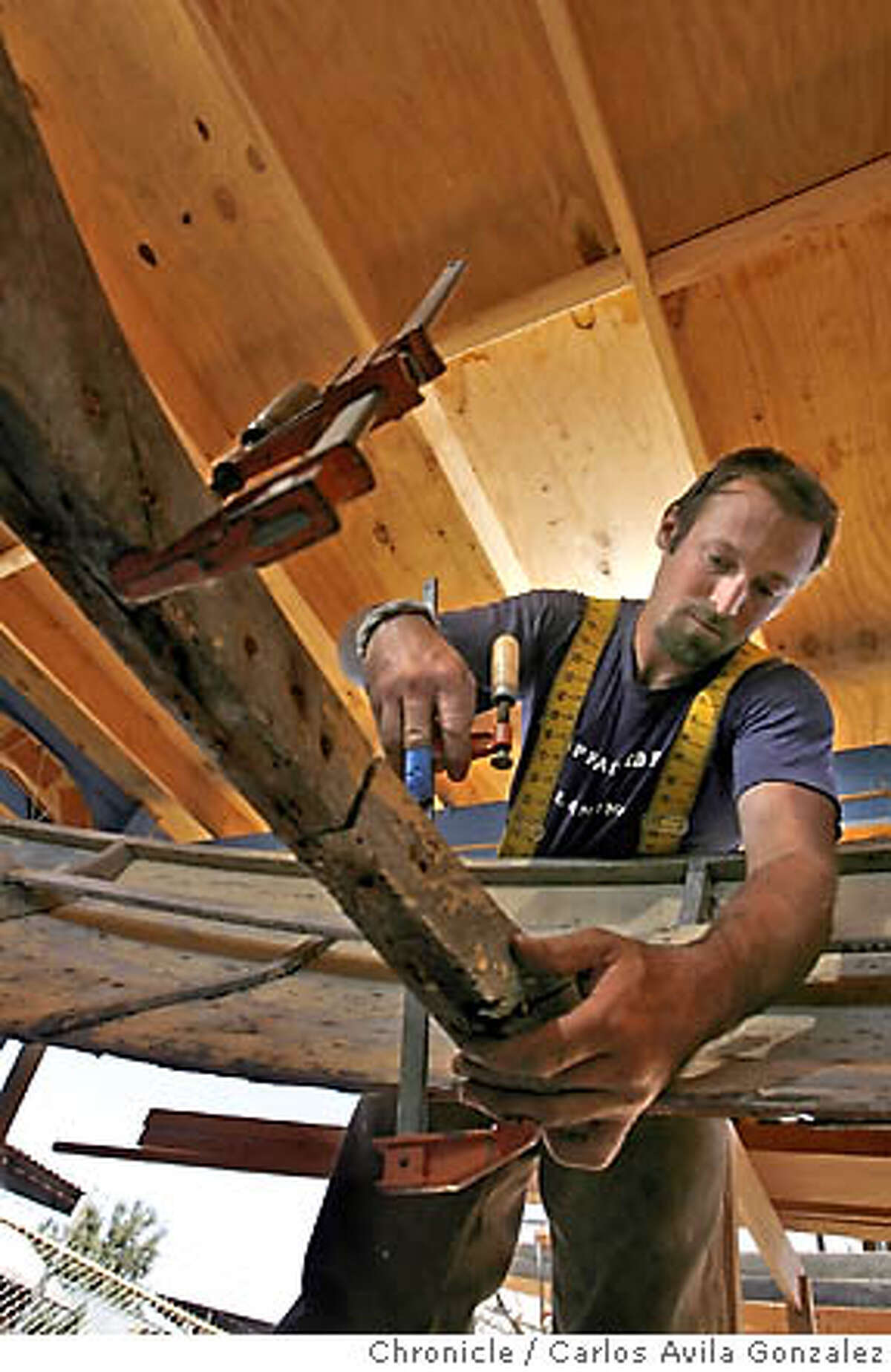Building boats the way they used to / Group of young carpenters turn ...