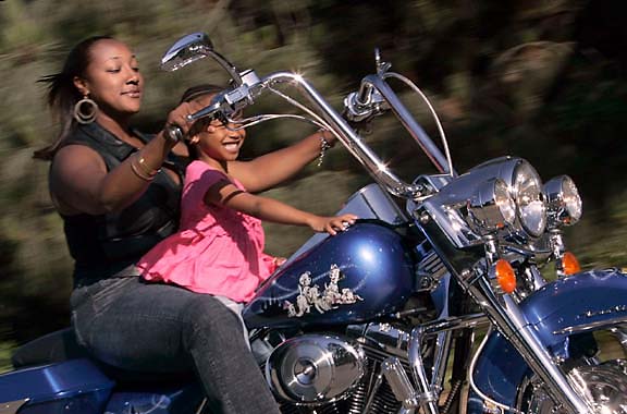 HOG WILD / Female motorcyclists steer their way to the head of the pack ...