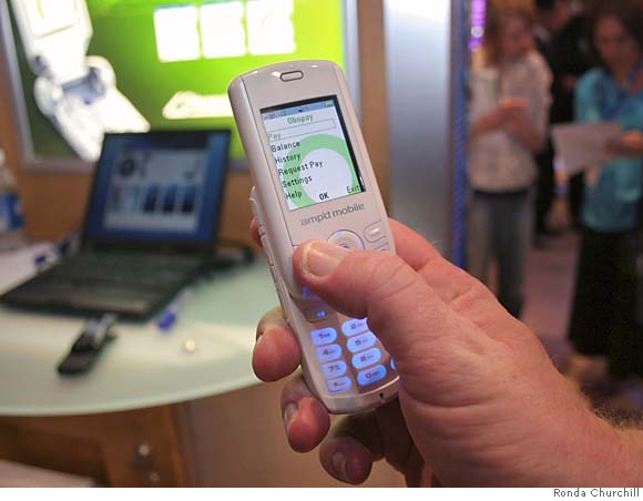 Short of cash? Buy it with your cell phone / Payment chip puts impulse ...