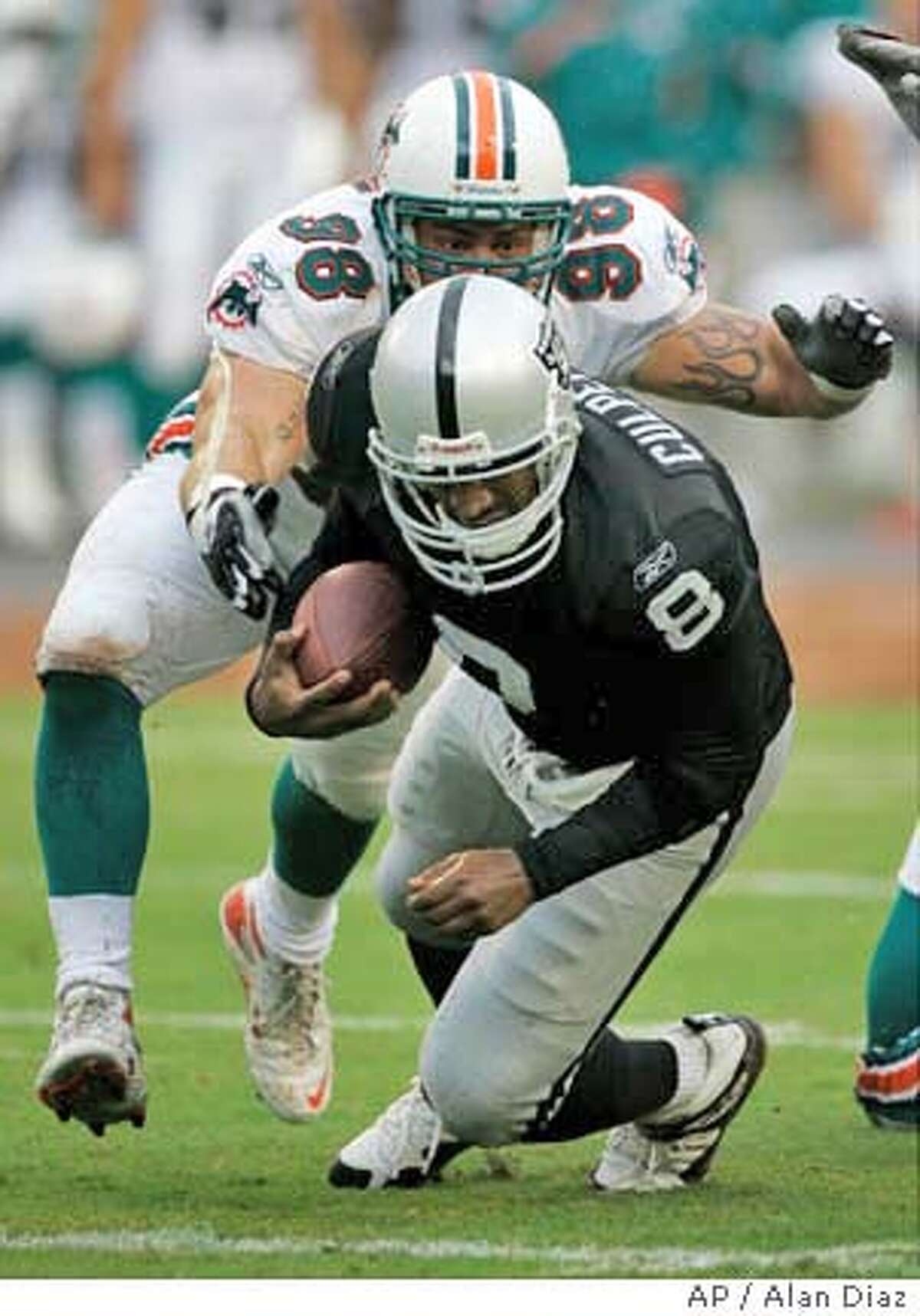 Raiders run past Dolphins and into first place