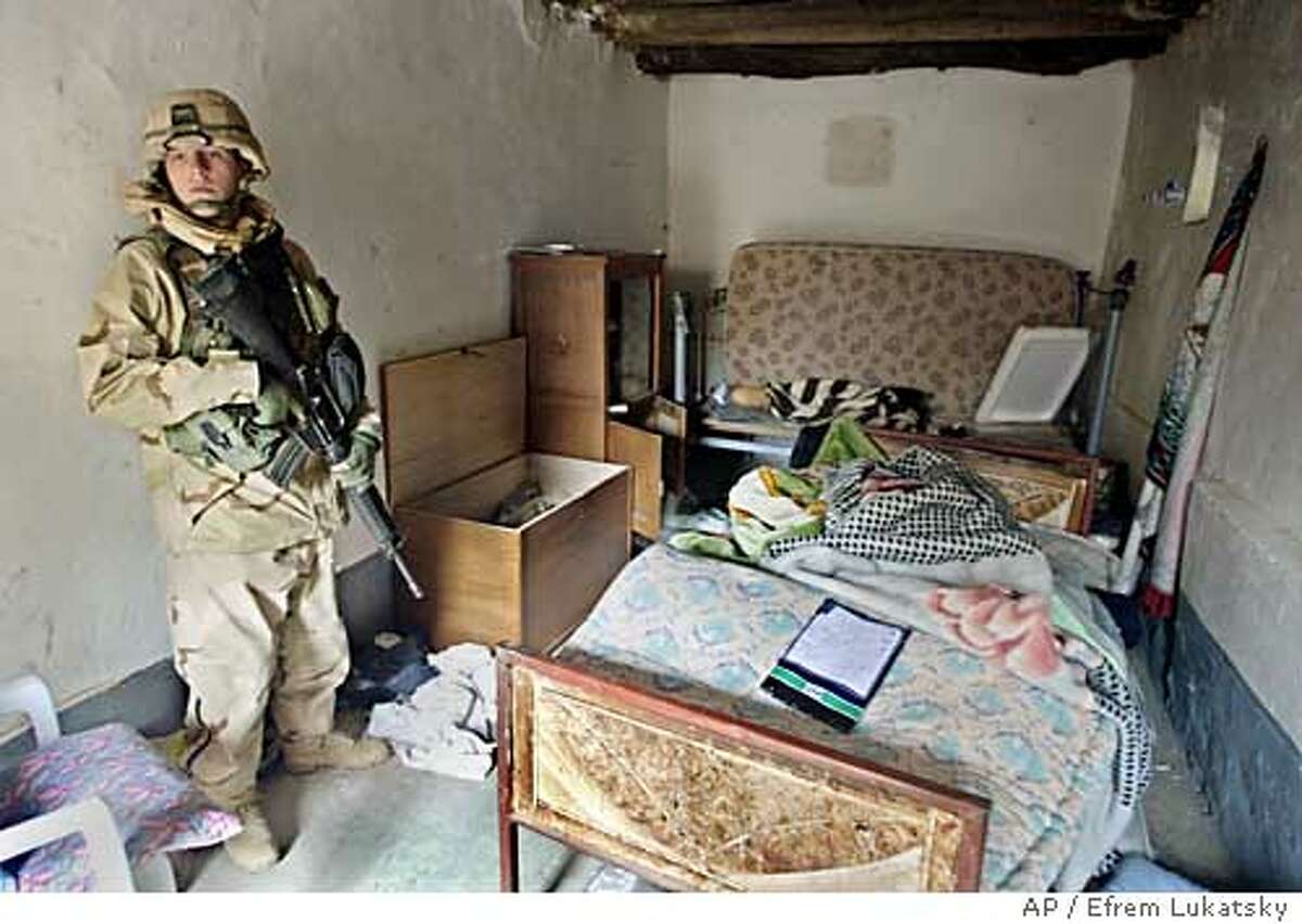 Hussein's hideaway a squalid shambles / Hut, litter belie former leader ...