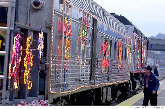 Holiday express / Santa rides the rails to delight, deliver for third year