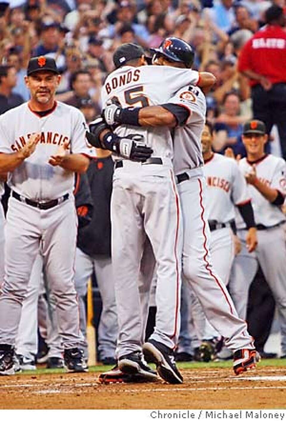 Side by side with Aaron / Bonds' historic home run, dogged by ...