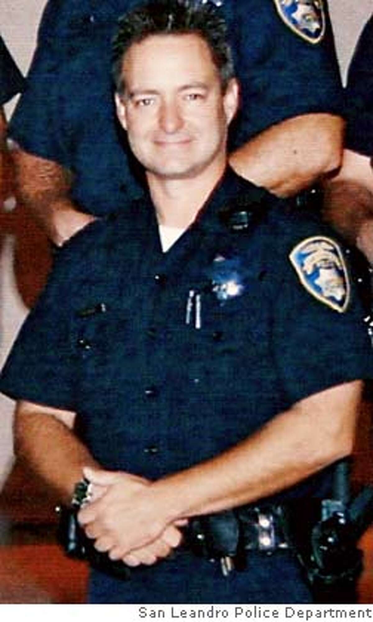 Brother of slain police officer lashes out at the killer in court