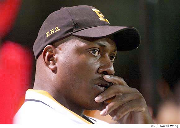 Tim McDonald / An active role model / Ex-NFL star leads by example as ...