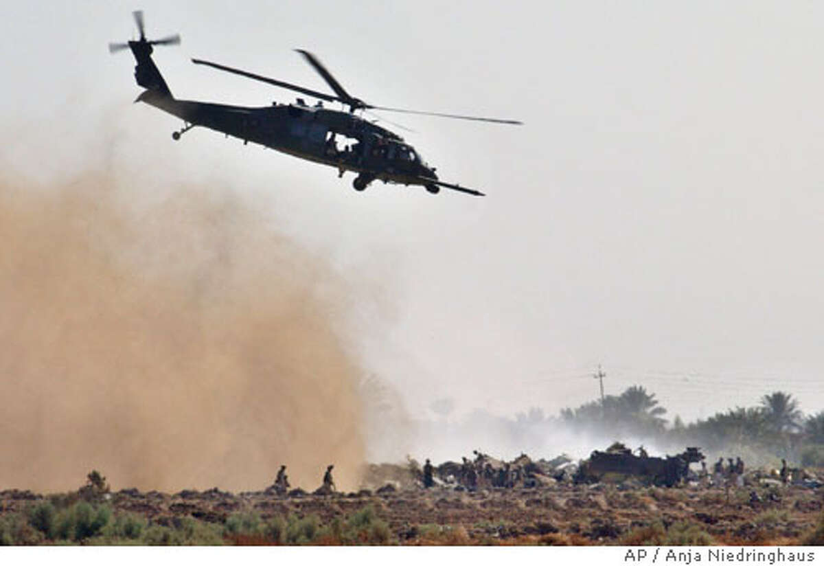 Fatal copter attack raises fears about Iraq insurgency / 16 killed, 20 ...