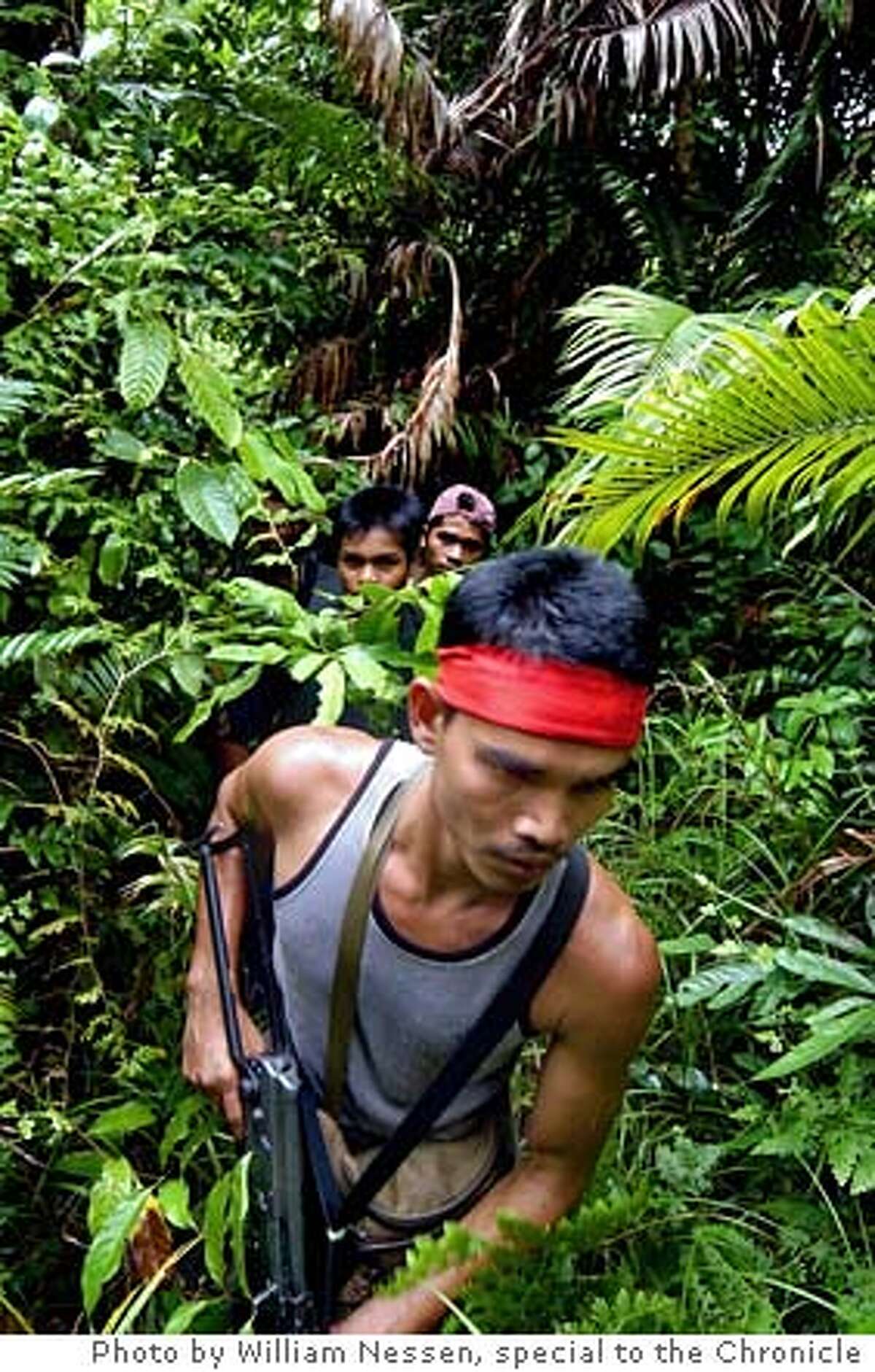 ON THE RUN IN ACEH / With the guerrillas in Indonesia's westernmost ...