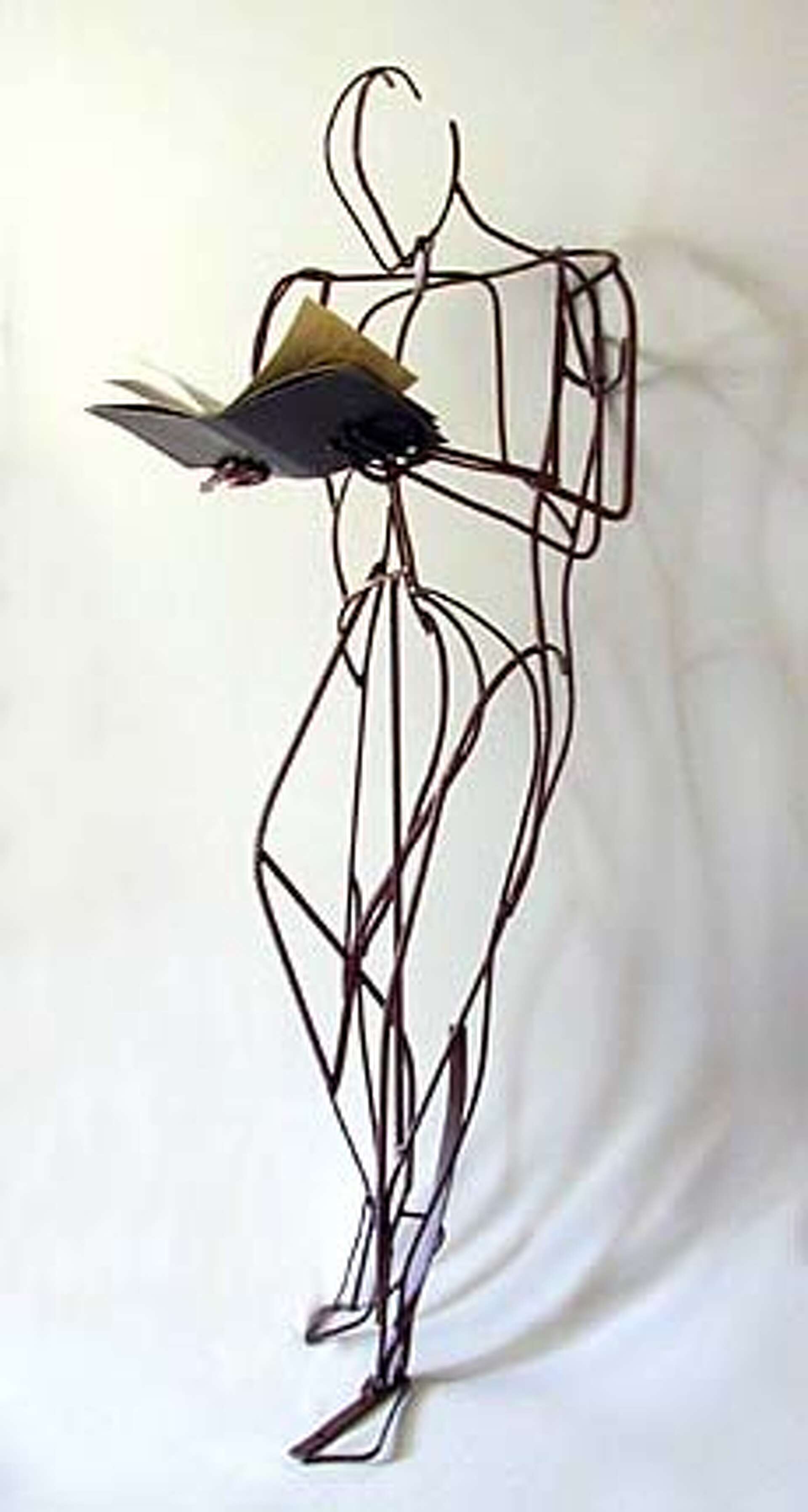 Trashing art / Artist revives junk's spirit, light and balance