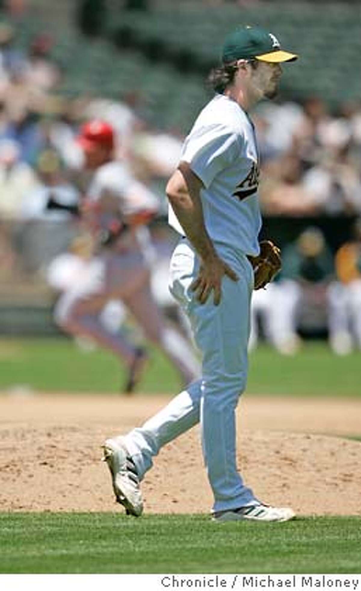 Rock-solid A's keep on rolling / Cust, bullpen fuel comeback win