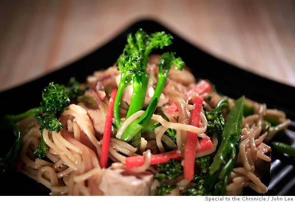 Chinese noodles tangle with tofu and vegetables