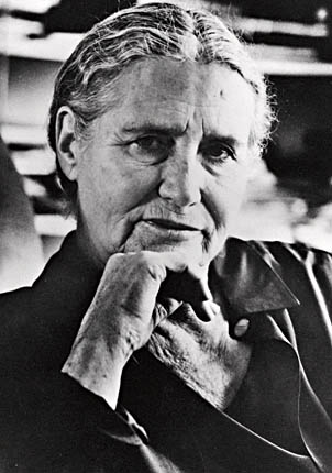 Lessing cleans off desk -- skillfully