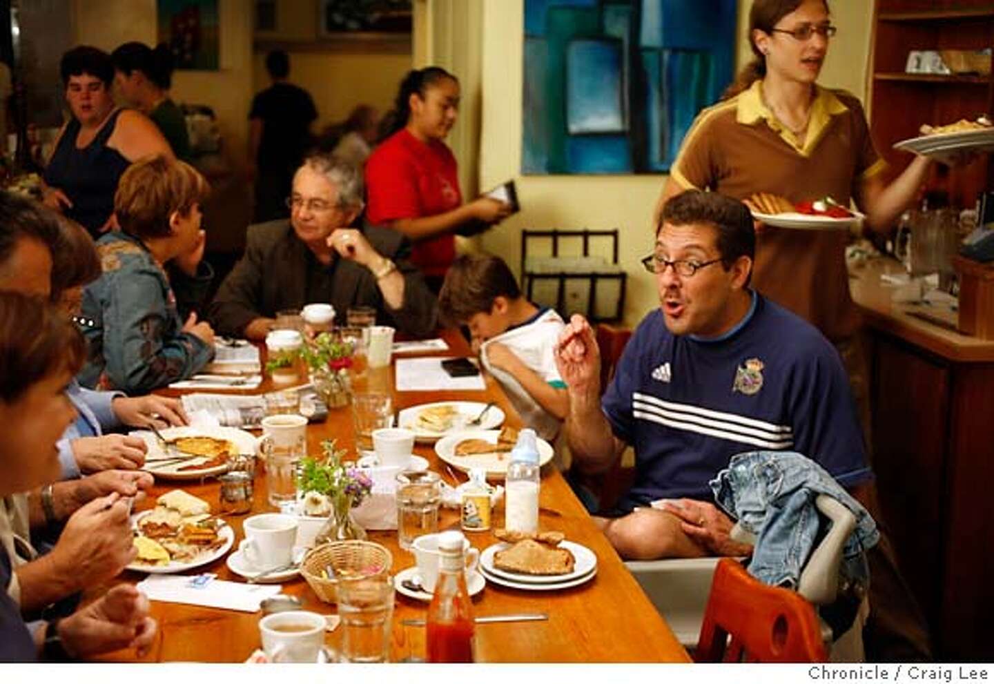 A PLACE AT THE TABLE / Restaurant communal dining catches on