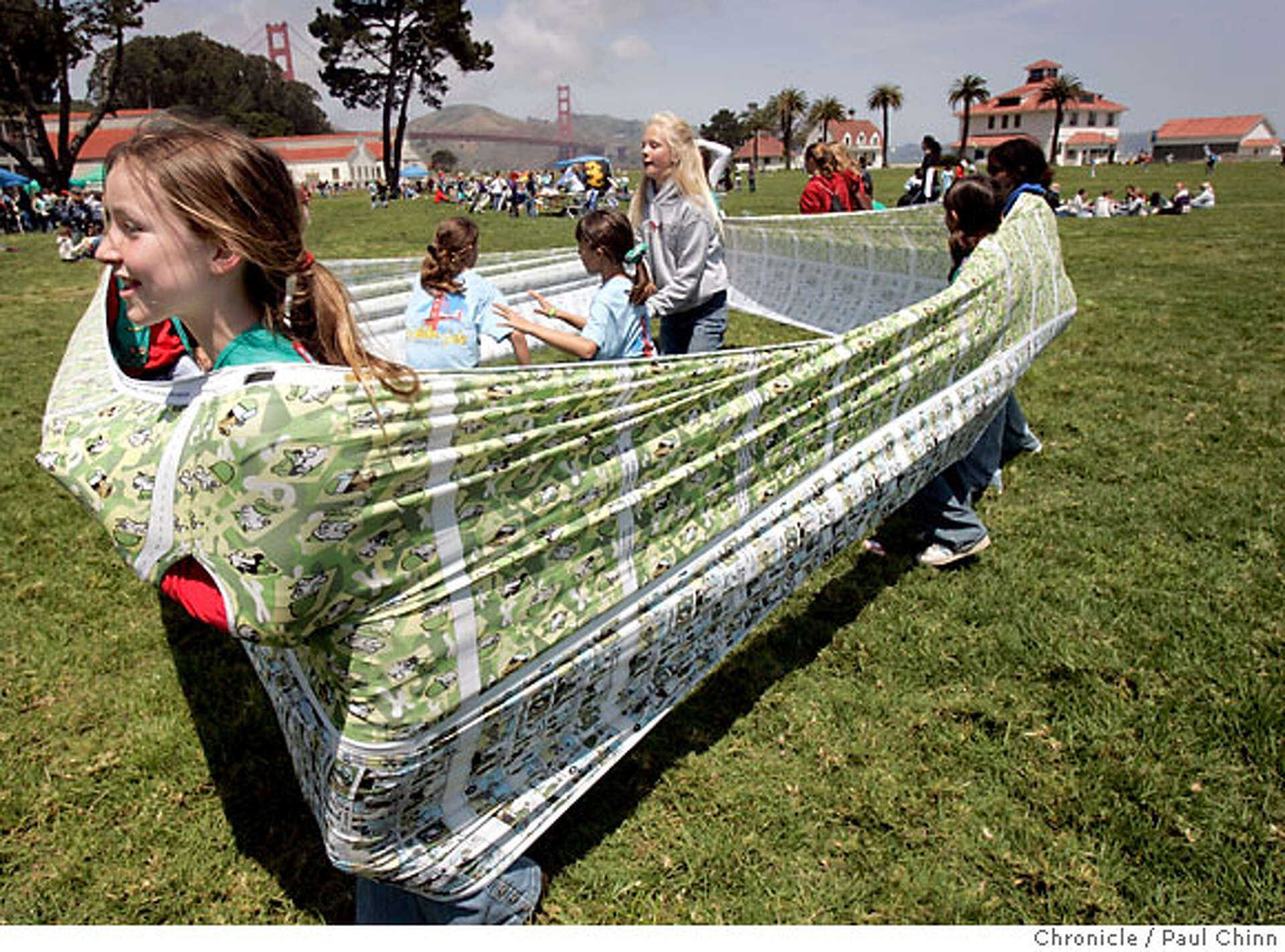 Girl Scouts cross a bridge