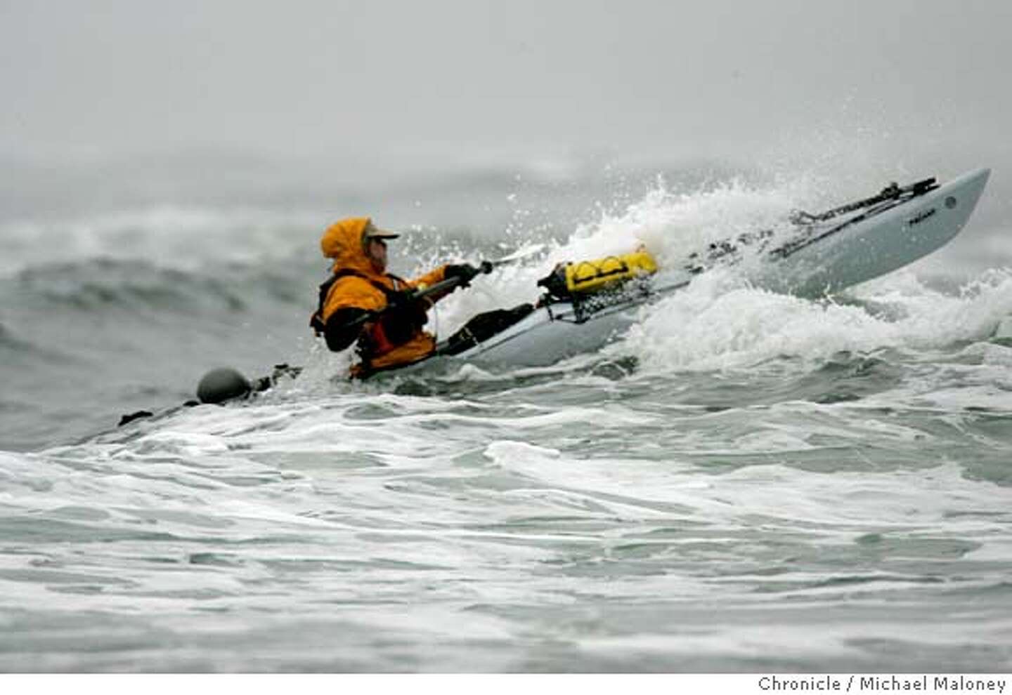 BREAKING THE WAVES / Surrounded by fog and wary of the rough waters ...