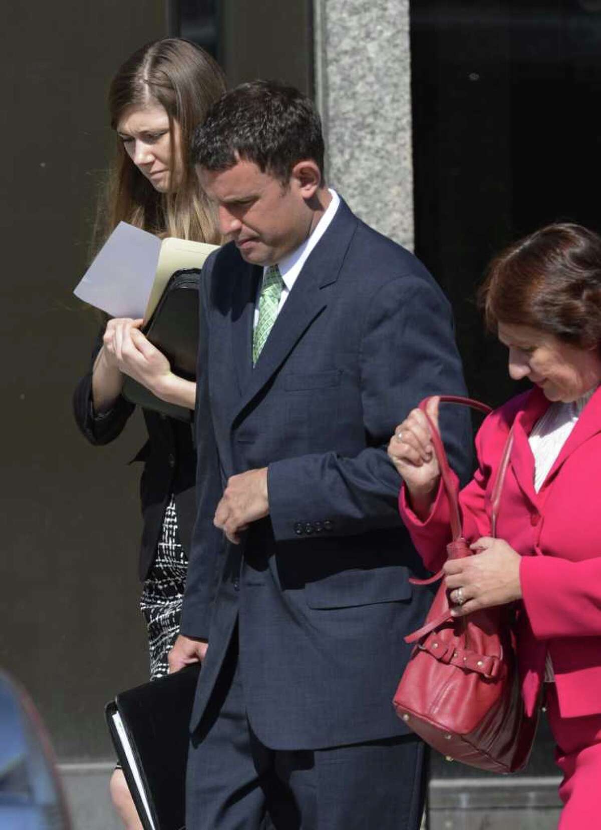 Ex-county prosecutor accused of attacking his wife
