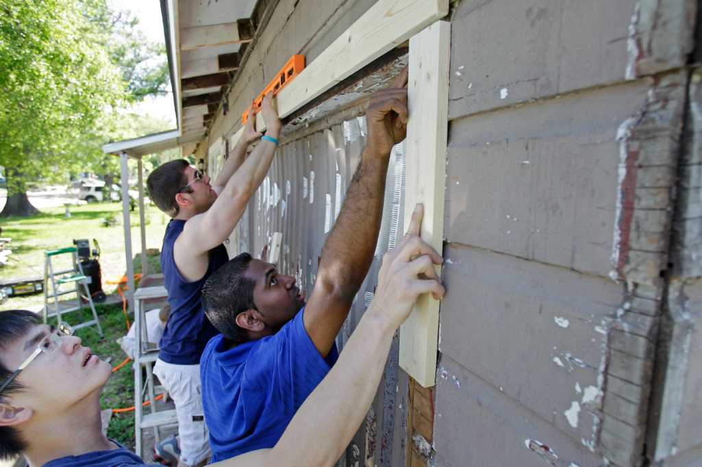 Volunteers repair and renovate damaged homes