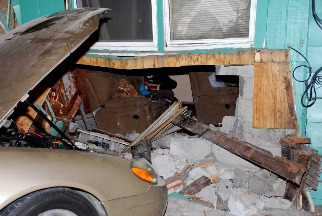 Car smashes through wall at Albany house