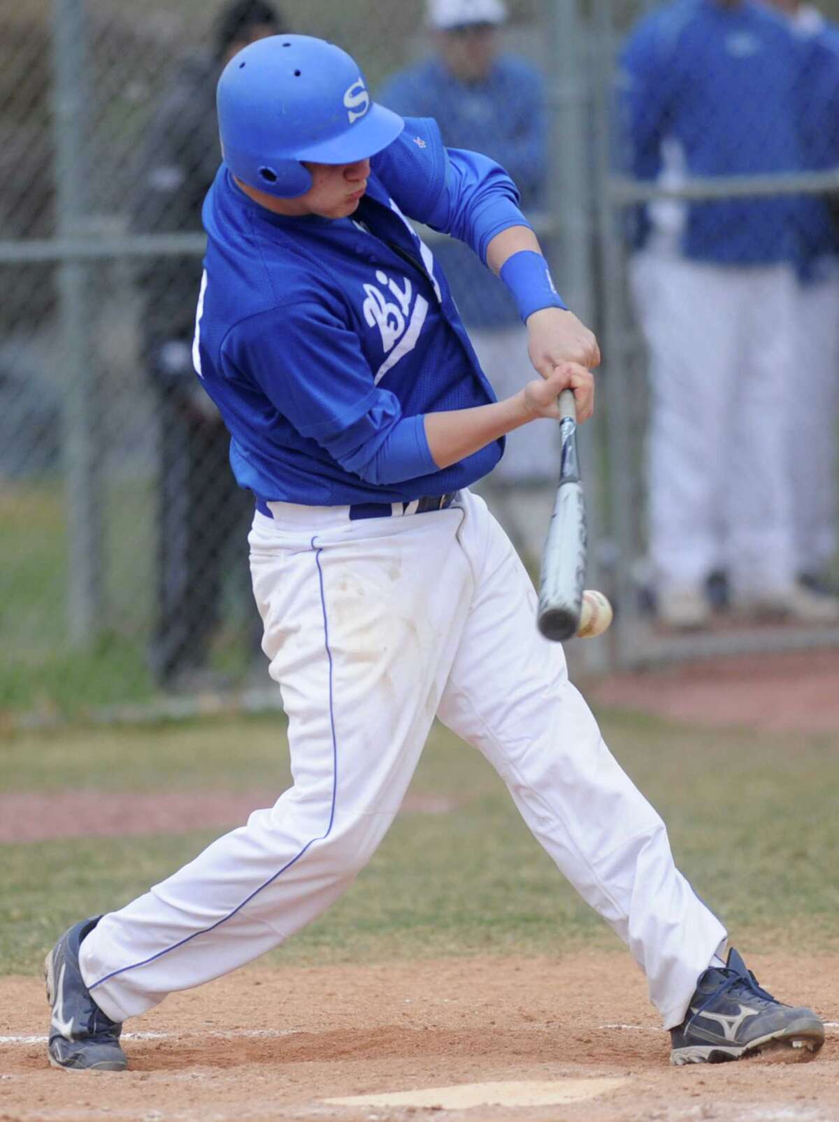 Hitting books and baseballs