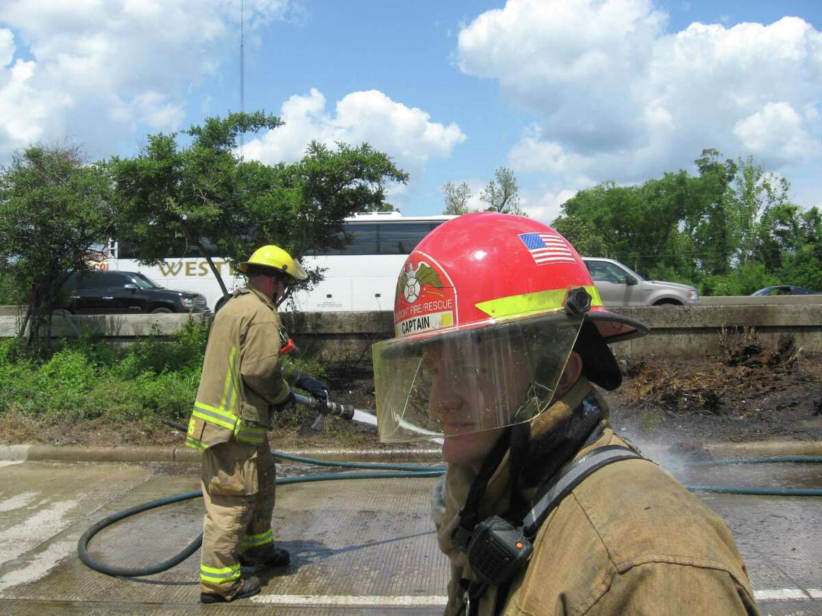 Highway embankment fire burns tire