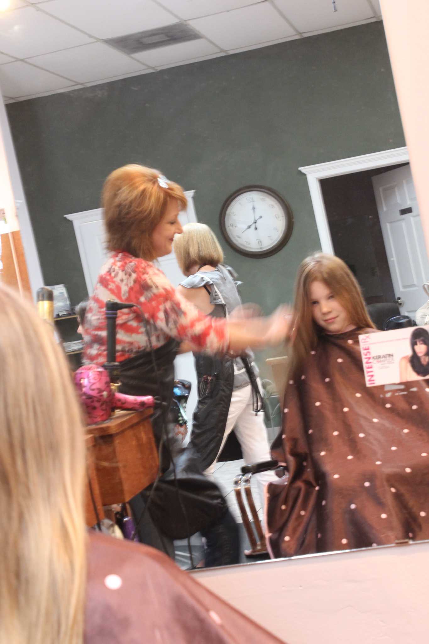 Mid-County girl cuts long locks for love