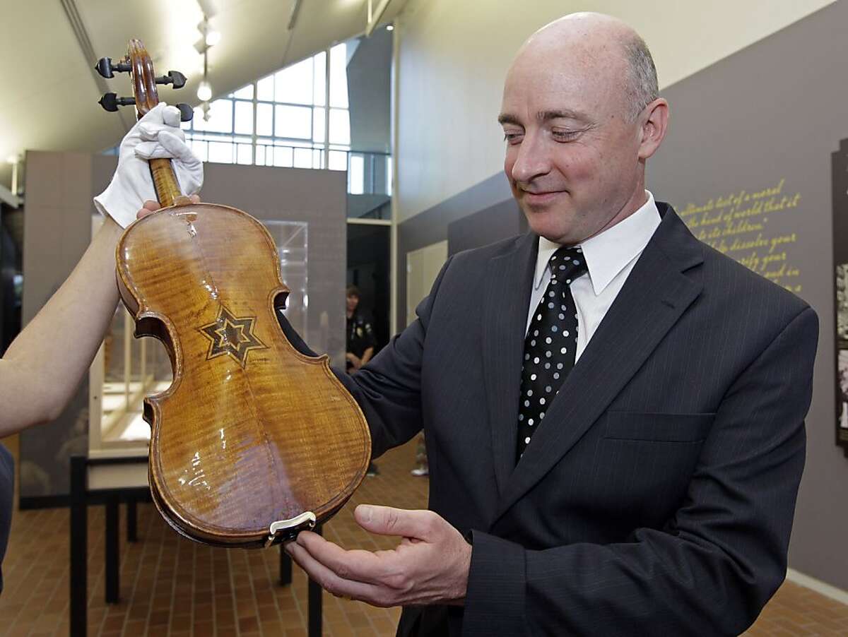 Restored violins bear sound, remembrance of Holocaust