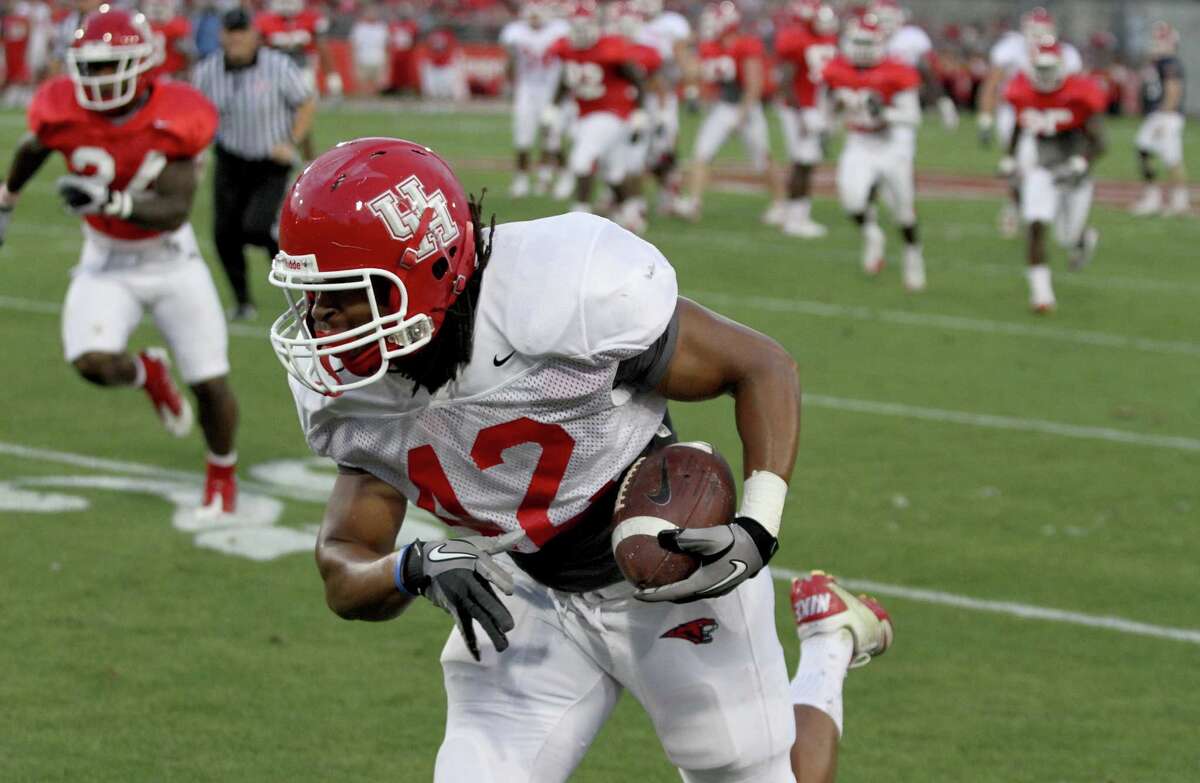Running back stars in Red's win over White at UH spring game