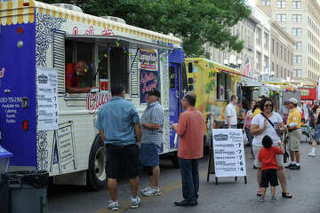 Towering hats, pins on parade mark Fiesta's kickoff