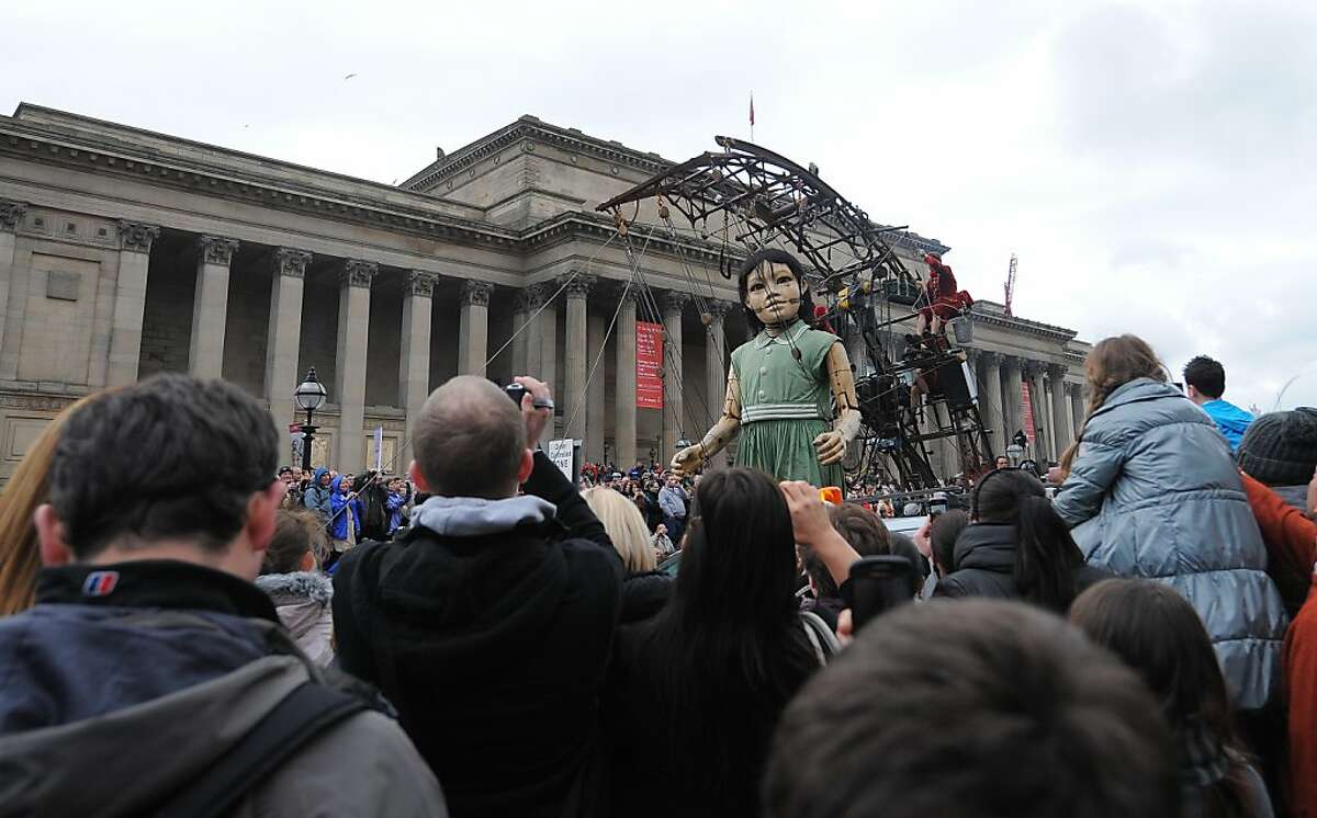 Giant puppets roam streets of Liverpool