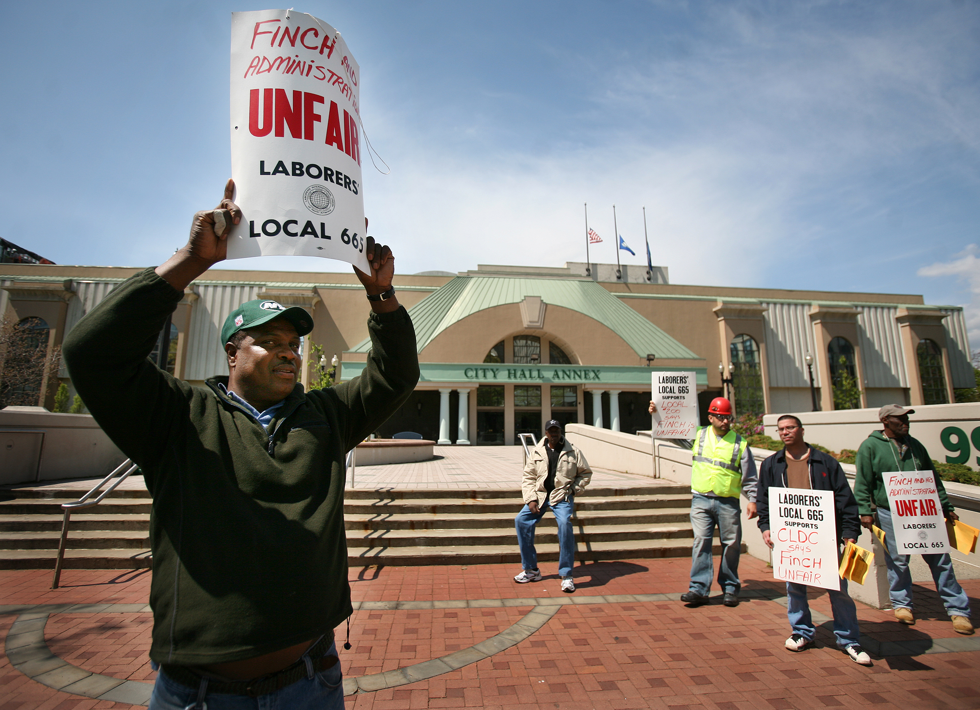 Union members protest at City Hall