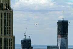 News of the world in photos: Space shuttle takes Manhattan