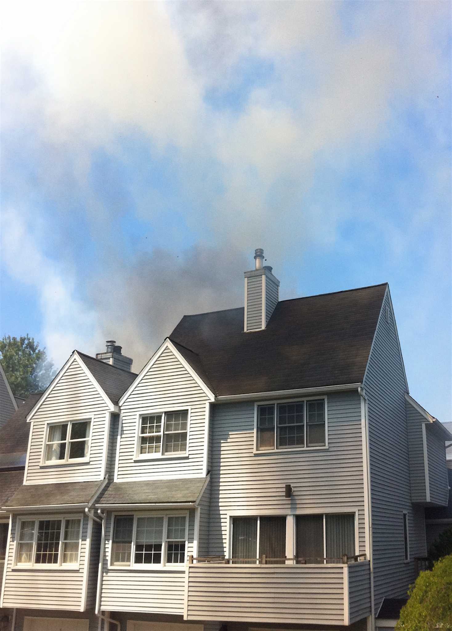 Firefighters battle fire at Wilton condo