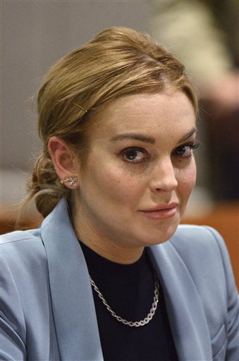 Famous faces: Lohan back at work after highway crash