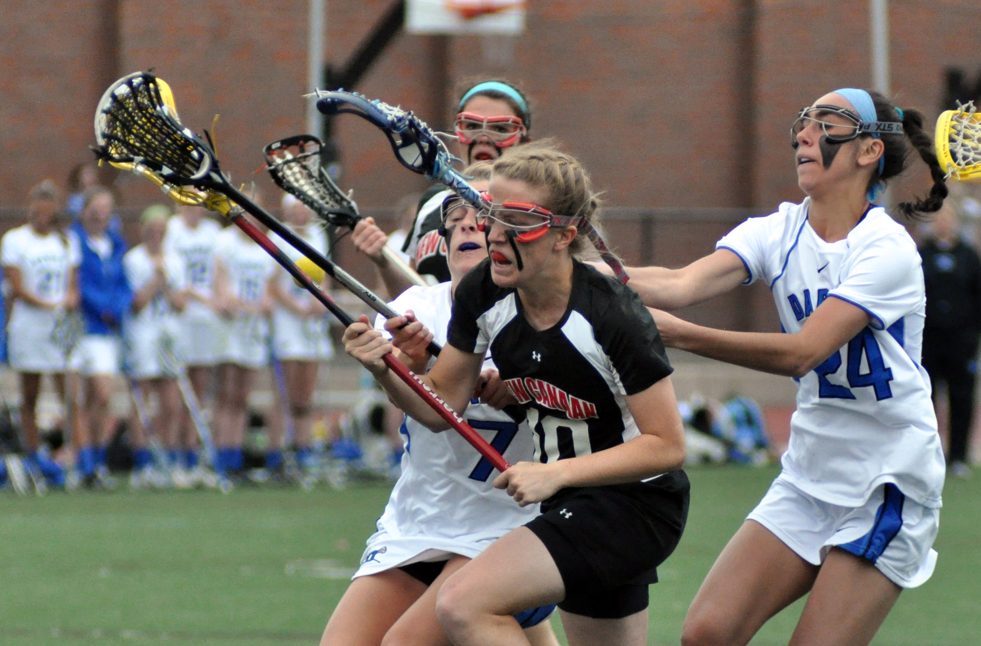 New Canaan's Mannelly a rare 3-sport star