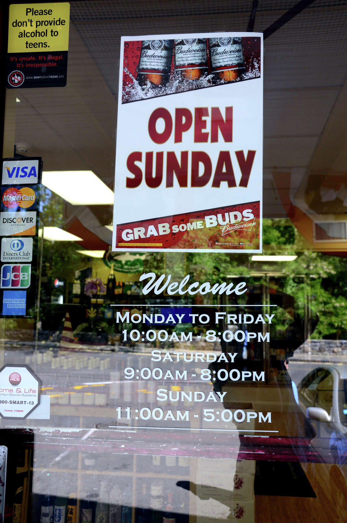 Liquor store customers toast Sunday sales