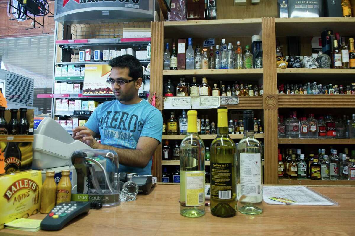Liquor store customers toast Sunday sales